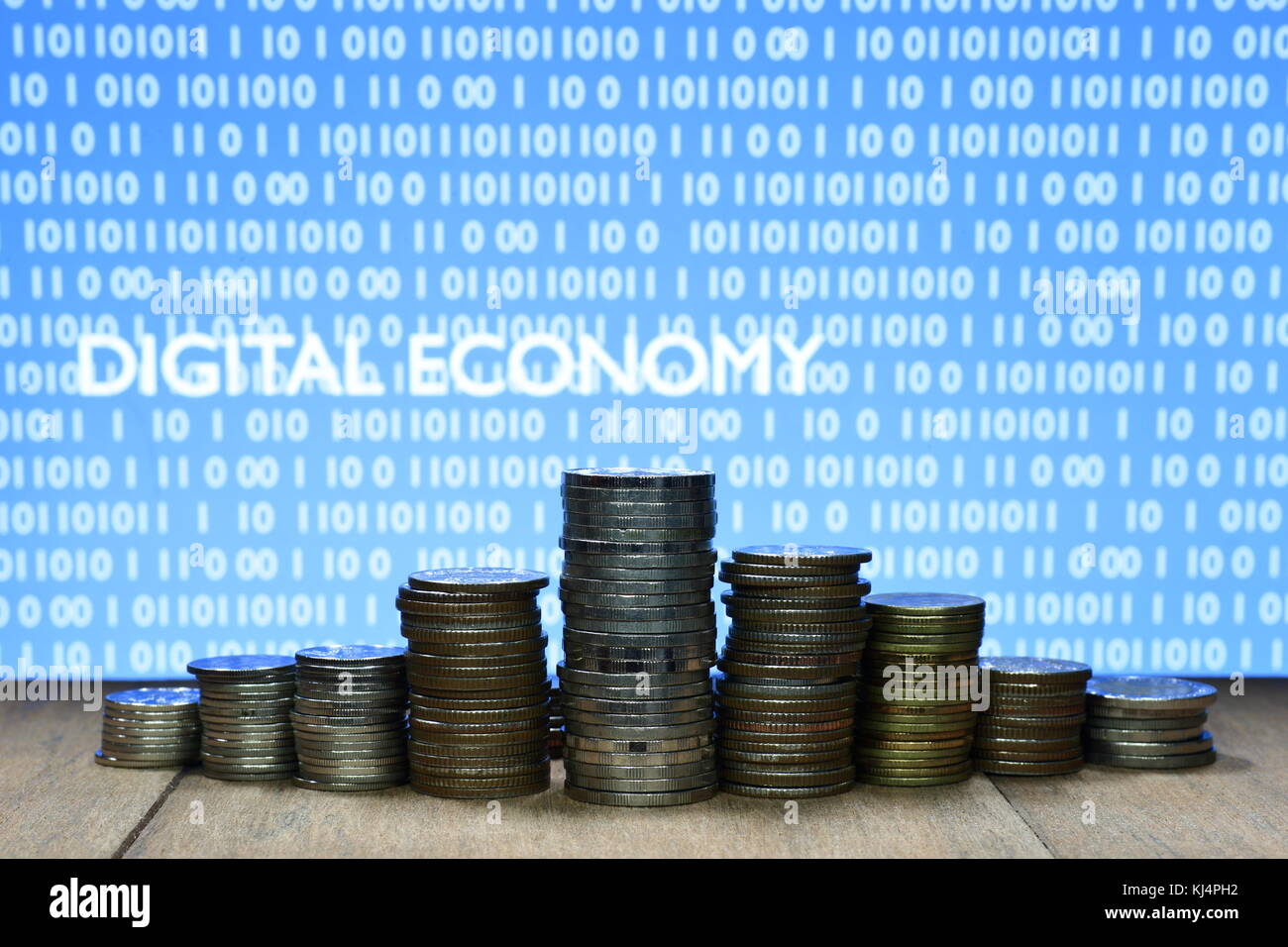 Digital economy. Coin stack pyramid shape with digital economy text and ...