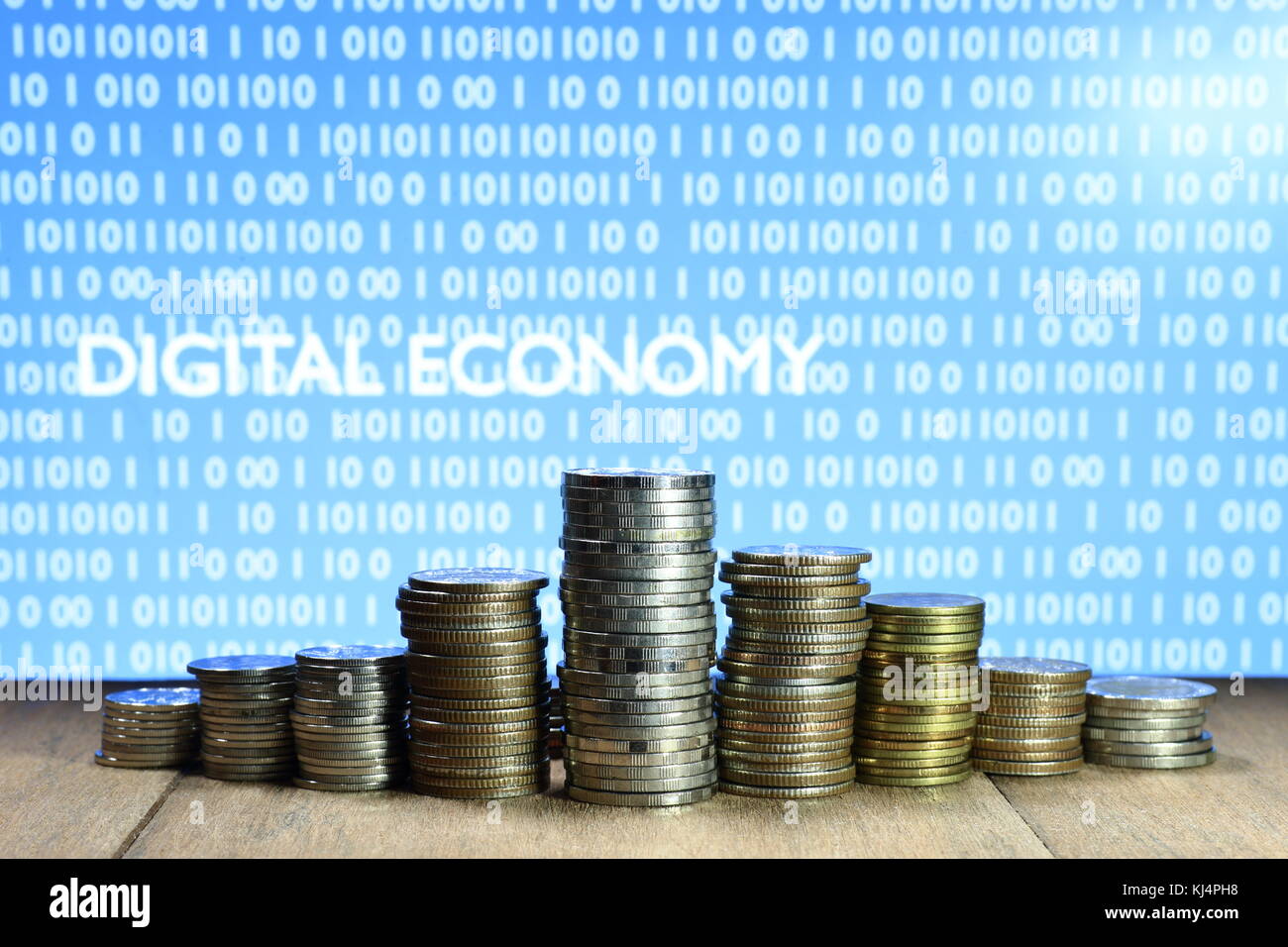 Digital economy. Coin stack pyramid shape with digital economy text and ...