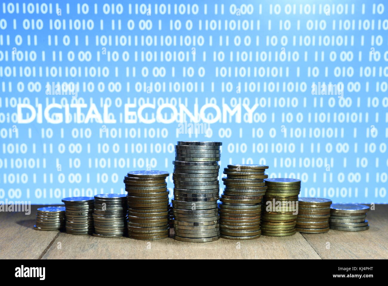 Digital economy. Coin stack pyramid shape with digital economy text and ...