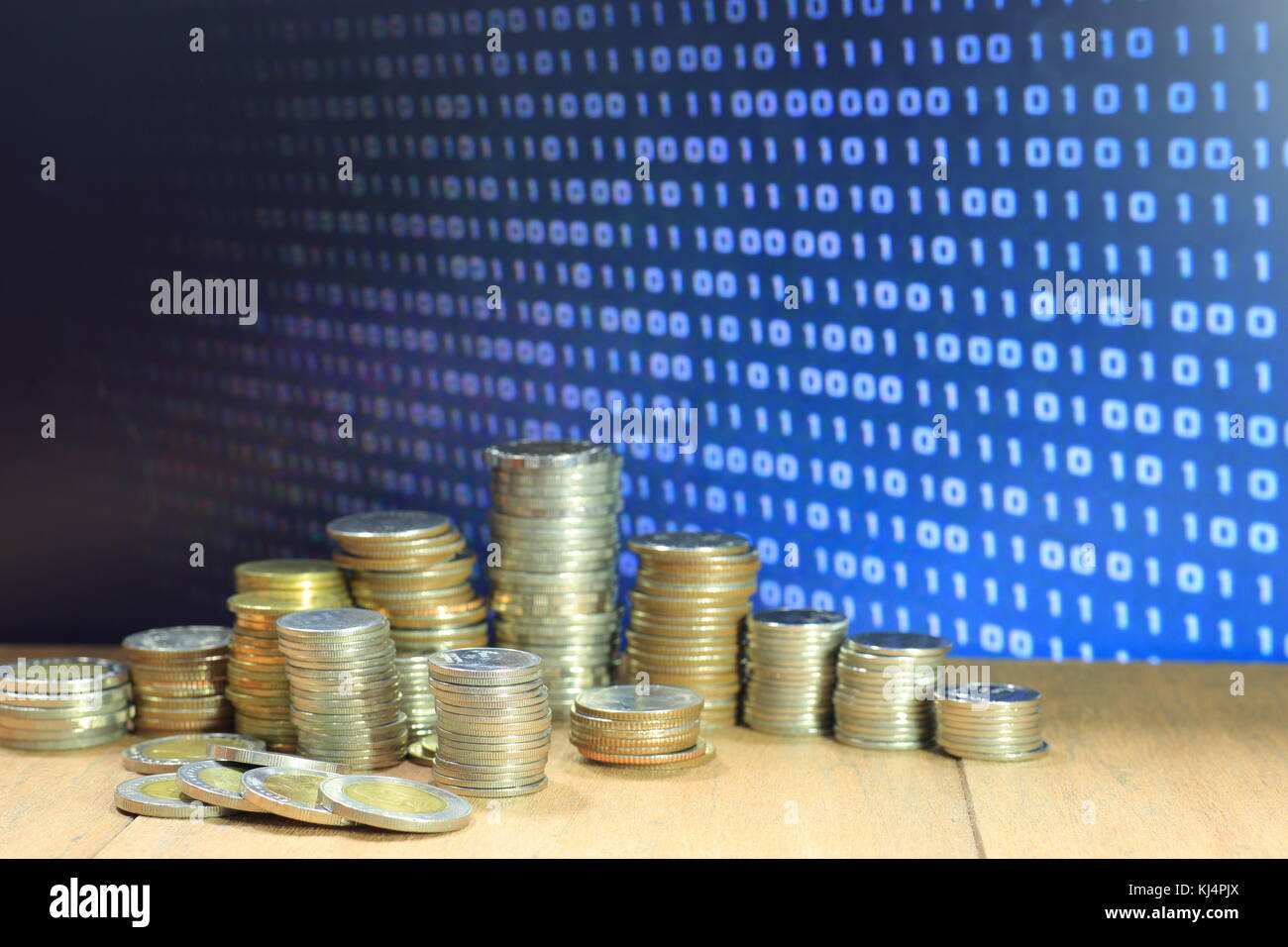 Digital economy. Coin stack with blue binary digital numbers background ...