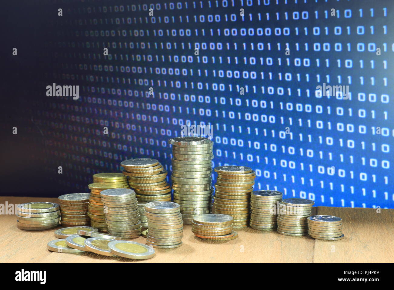 Digital economy. Coin stack pyramid shape with digital binary code in ...