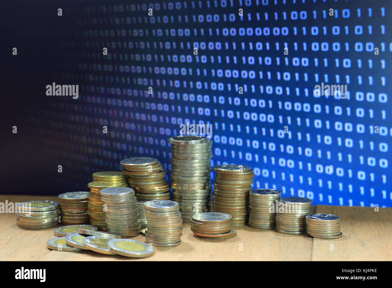 Digital economy. Coin stack pyramid shape with digital binary code in ...