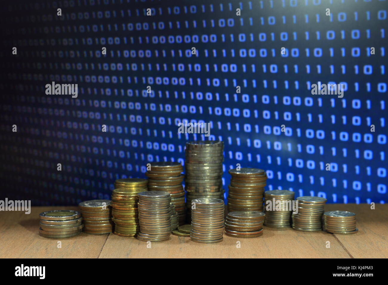 Digital economy. Coin stack with blue binary digital numbers background ...