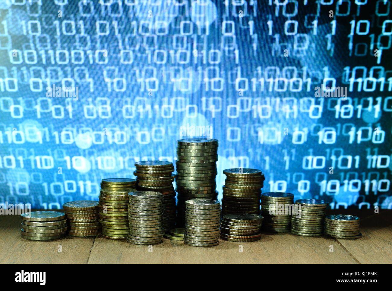 Digital economy. Coin stack pyramid shape with digital binary code in ...