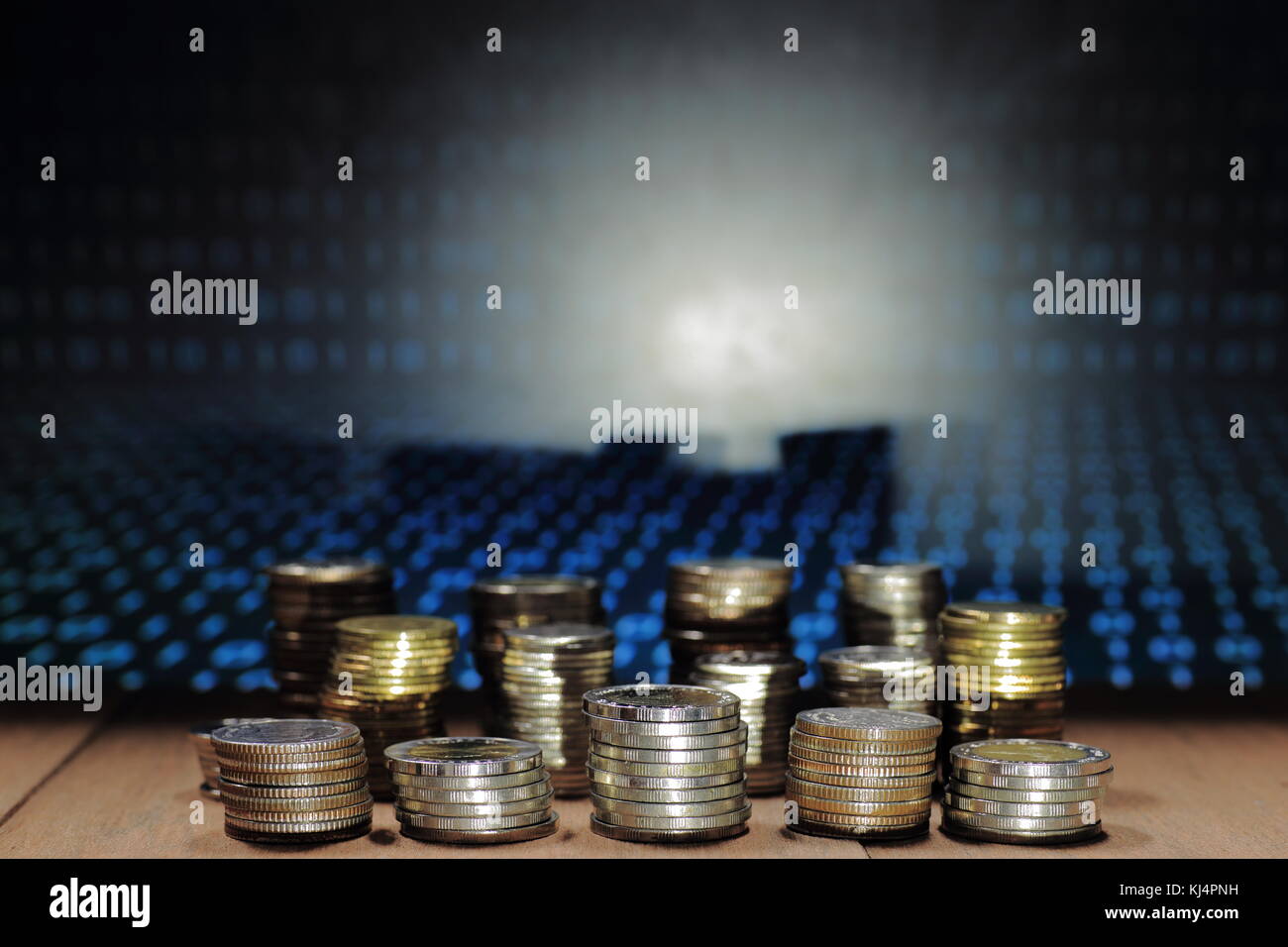 Digital economy. Coin stack with blue binary digital numbers background ...