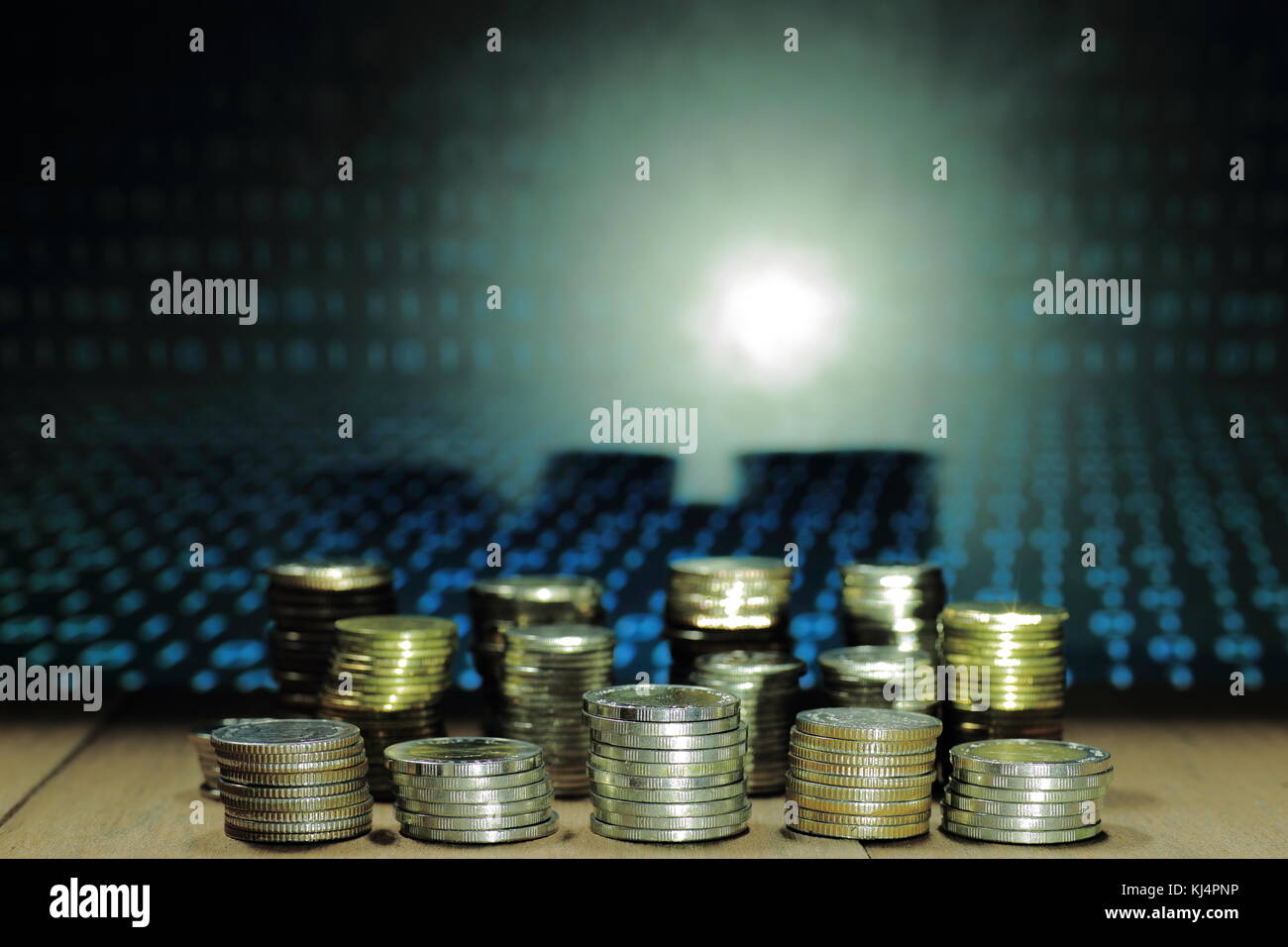 Digital economy. Coin stack with blue binary digital numbers background ...