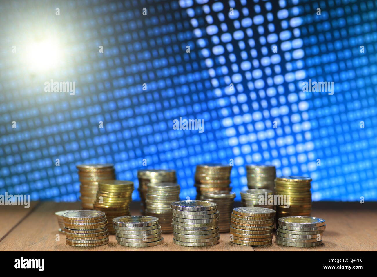 Digital economy. Coin stack with blue binary digital numbers background ...