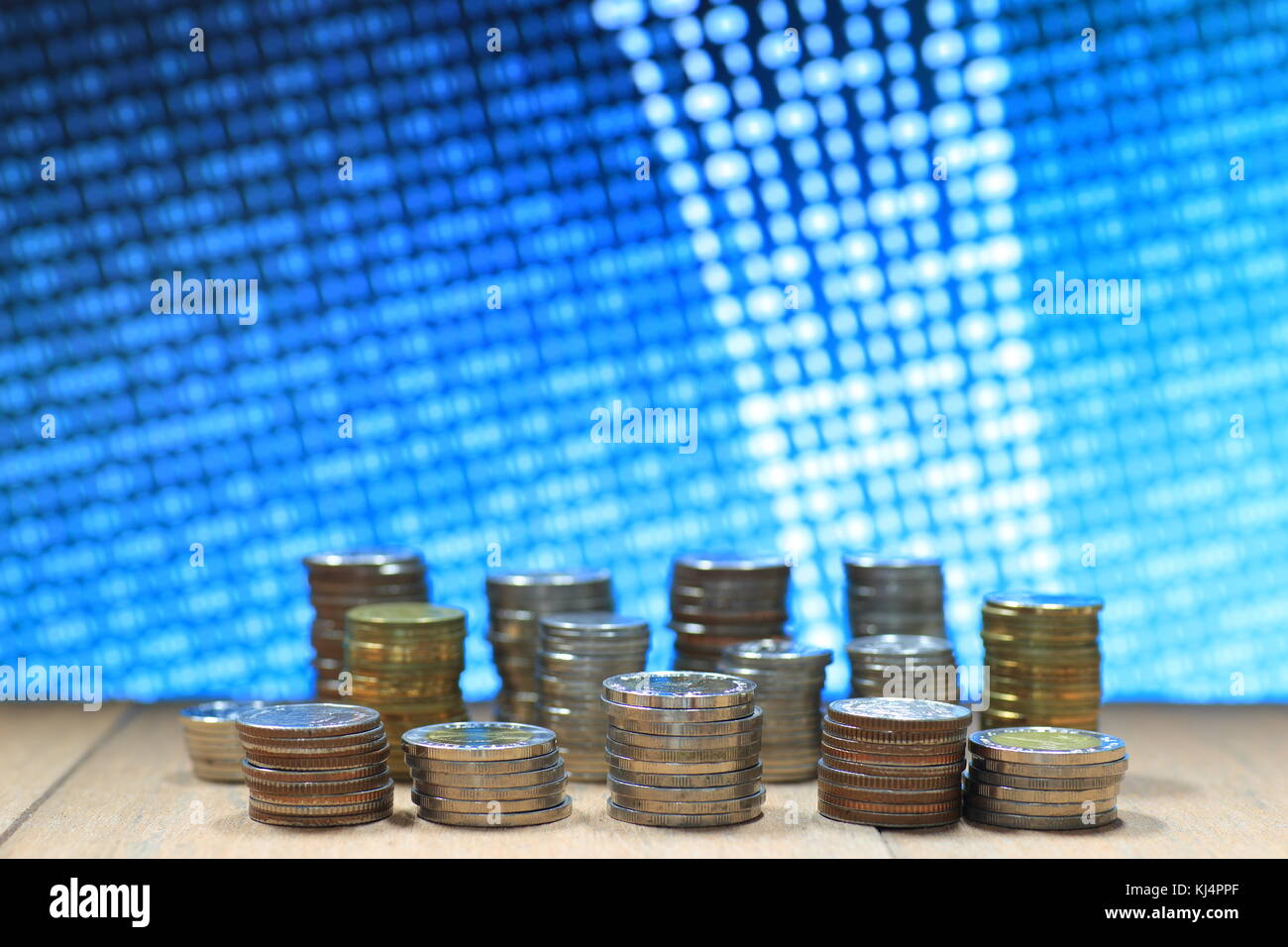 Digital economy. Coin stack pyramid shape with digital binary code in ...