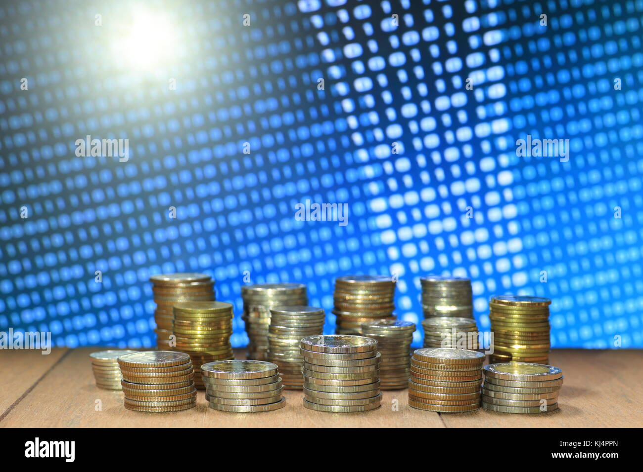 Digital economy. Coin stack with blue binary digital numbers background ...