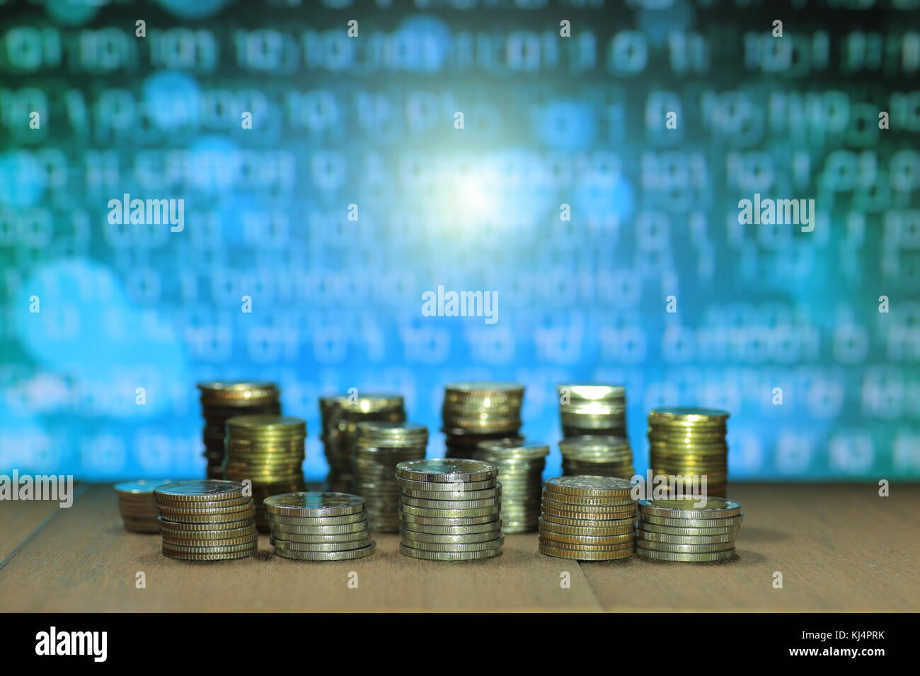 Digital economy. Coin stack with blue binary digital numbers background ...