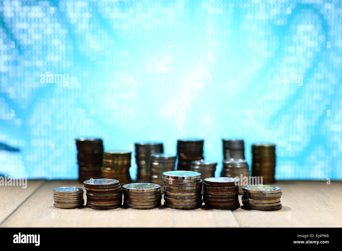 Digital economy. Coin stack with blue binary digital numbers background ...