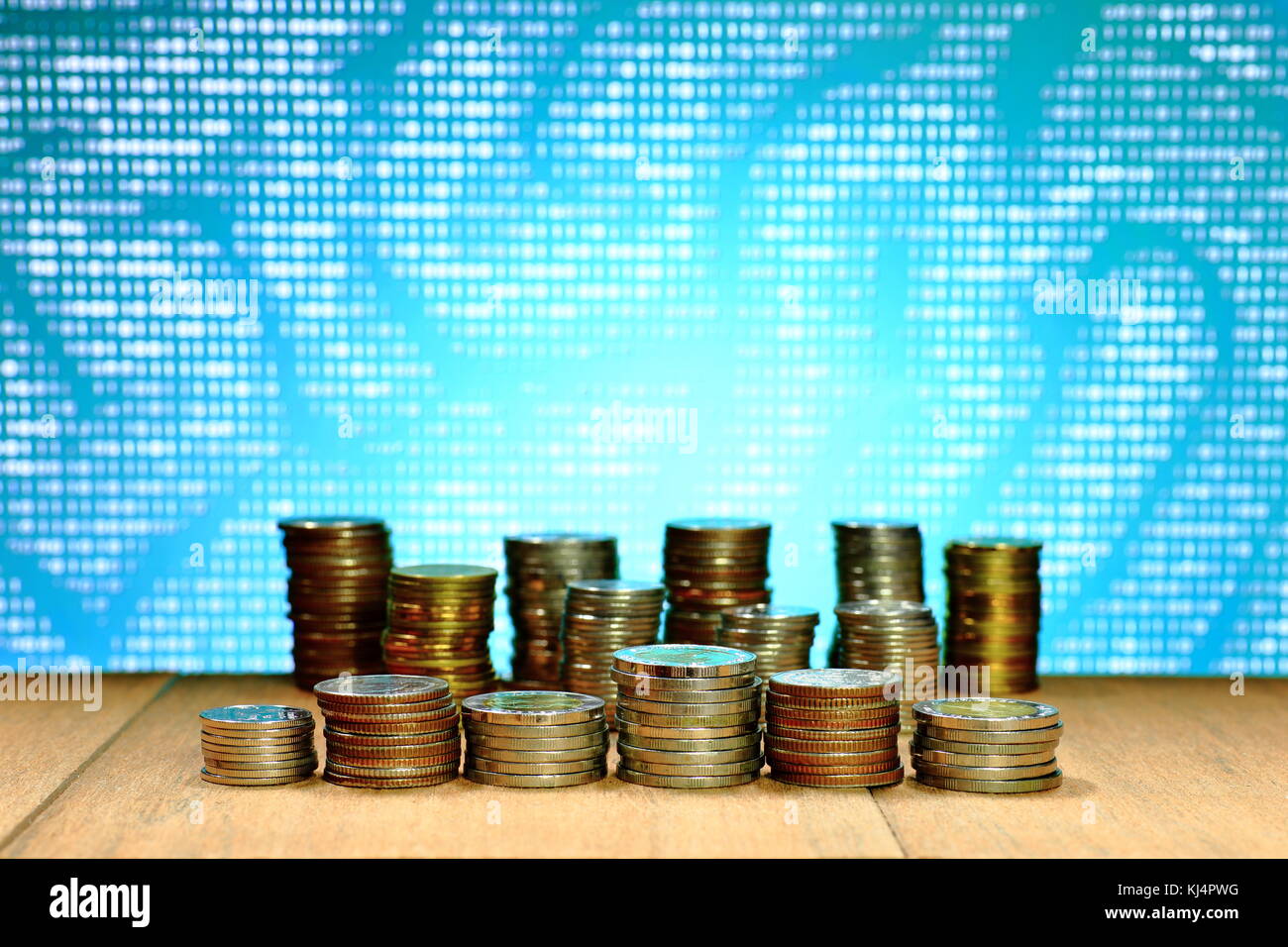 Digital economy. Coin stack with blue binary digital numbers background ...