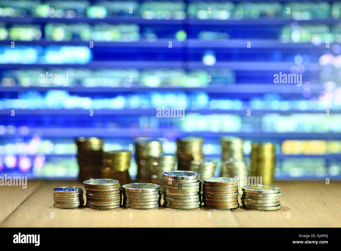 coin stack with blur office building background. Business, finance and ...