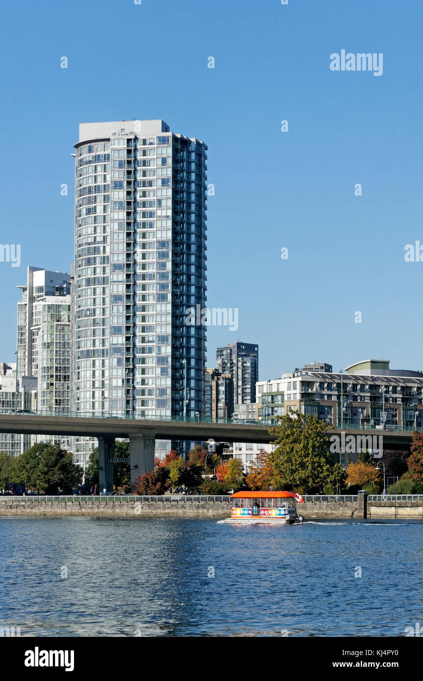 Aquabus passenger ferry on False Creek with Cambie Street bridge in ...