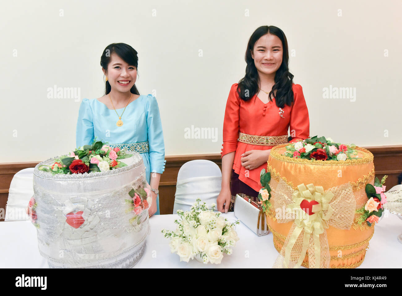 Traditional Lao wedding, Family of the bride in front of baskets where ...