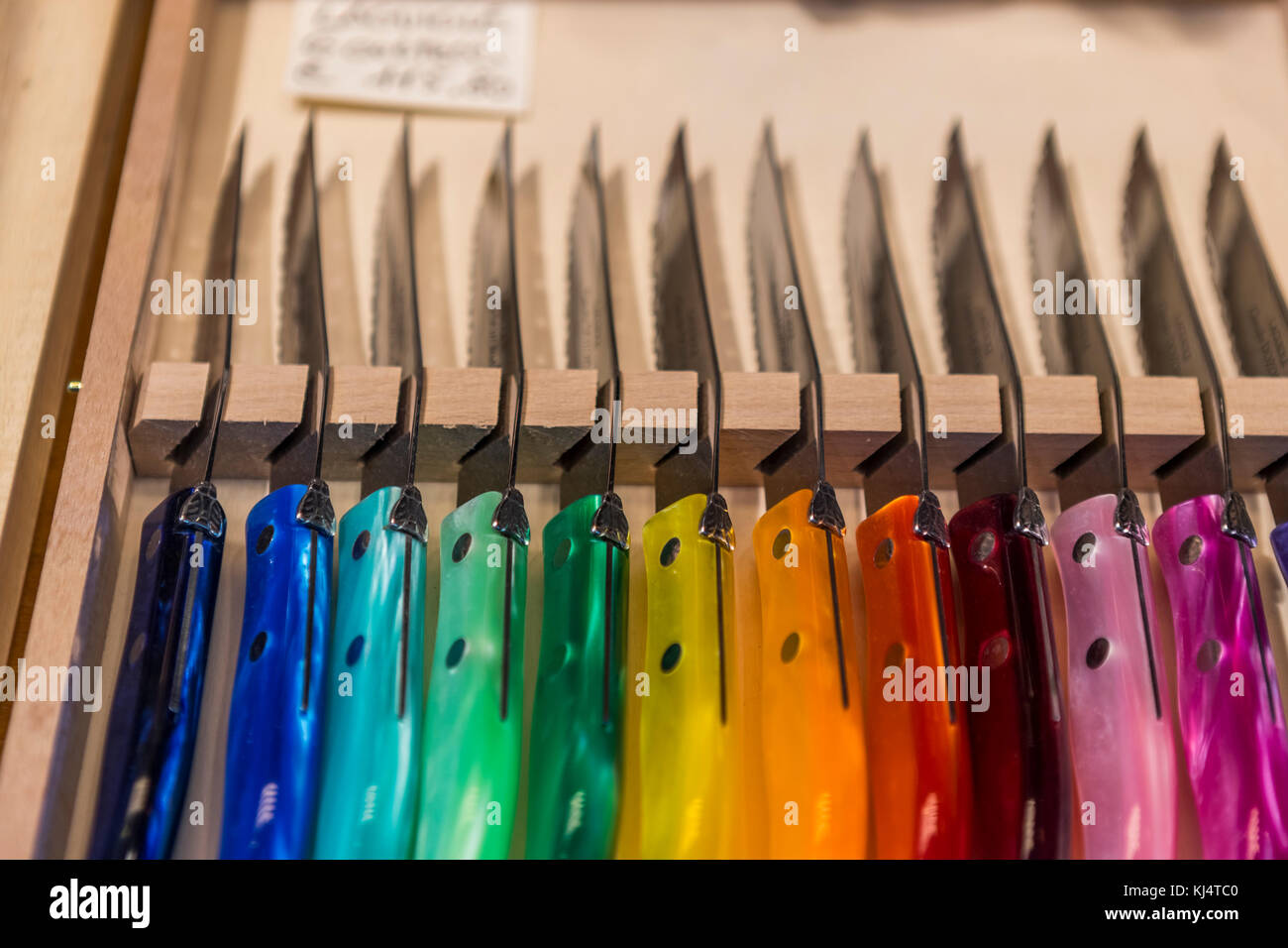 Multi coloured plastic handled knives on sale in Via Drapperie. Bologna ...