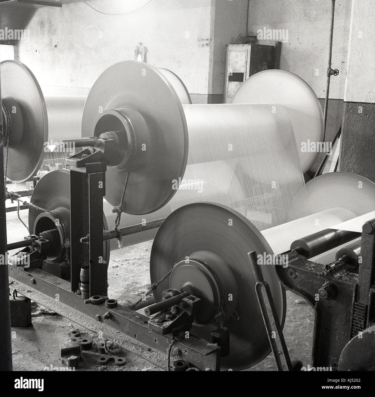 1950s, historical, close-up of the fast moving spinning wheels ...