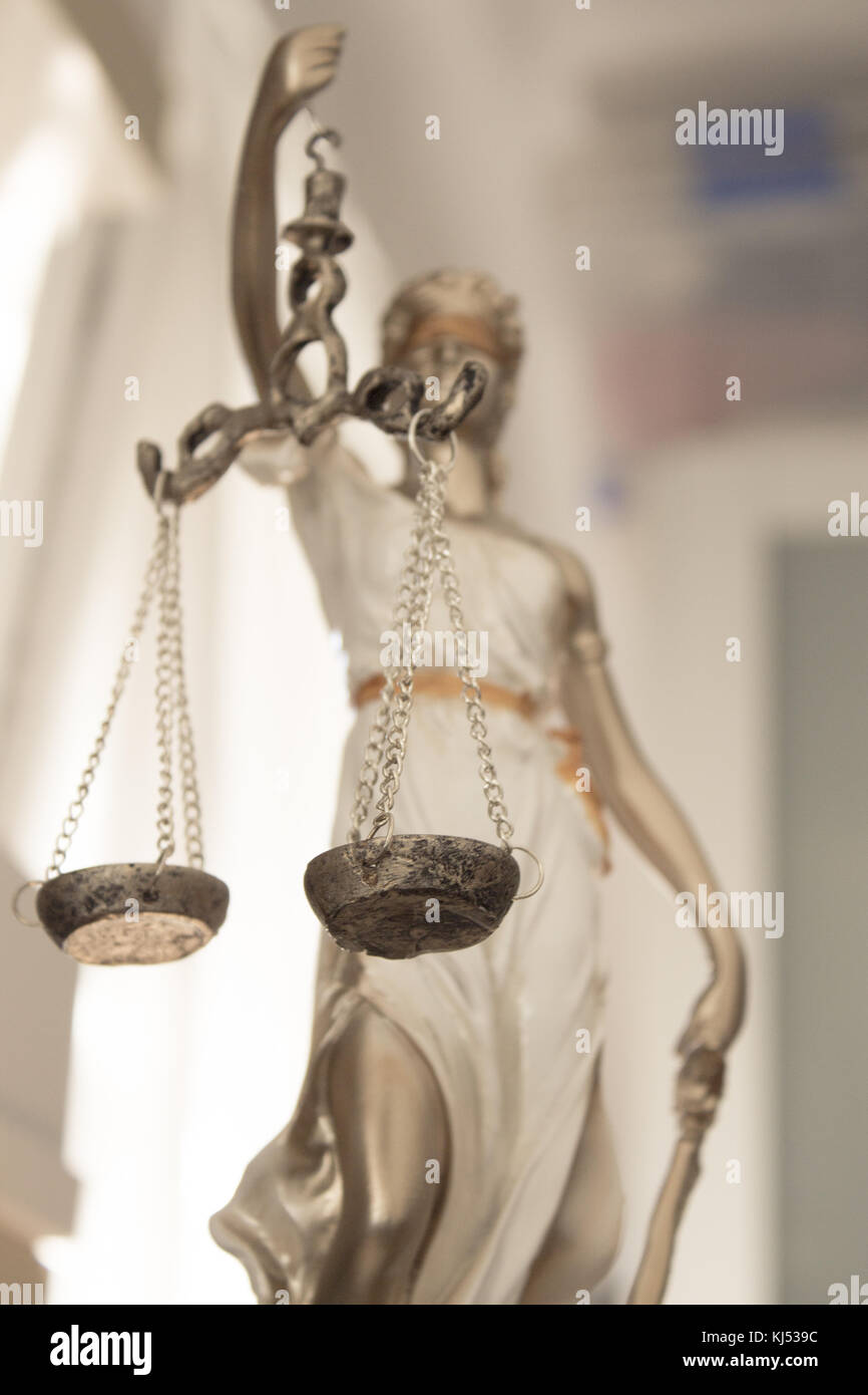 White female statue symbol of justice Themis. This figure has not ...