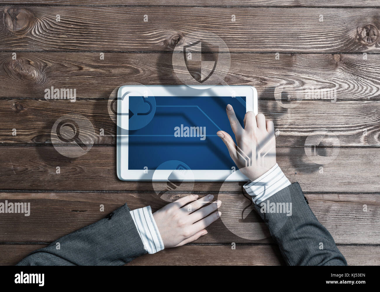 Business workplace with tablet device in female hands and media user ...