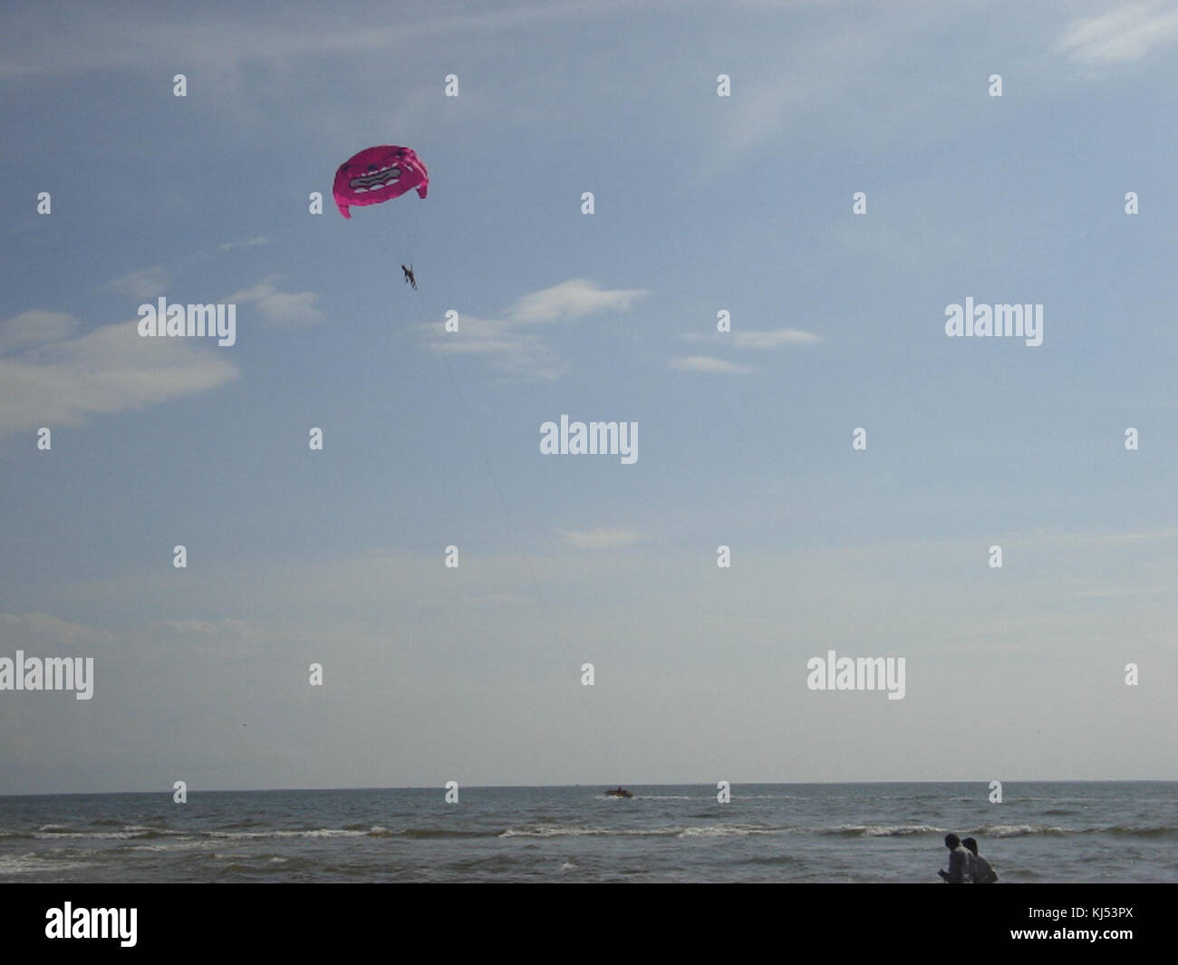 This image showcases parasailing in Colva, a popular beach destination ...