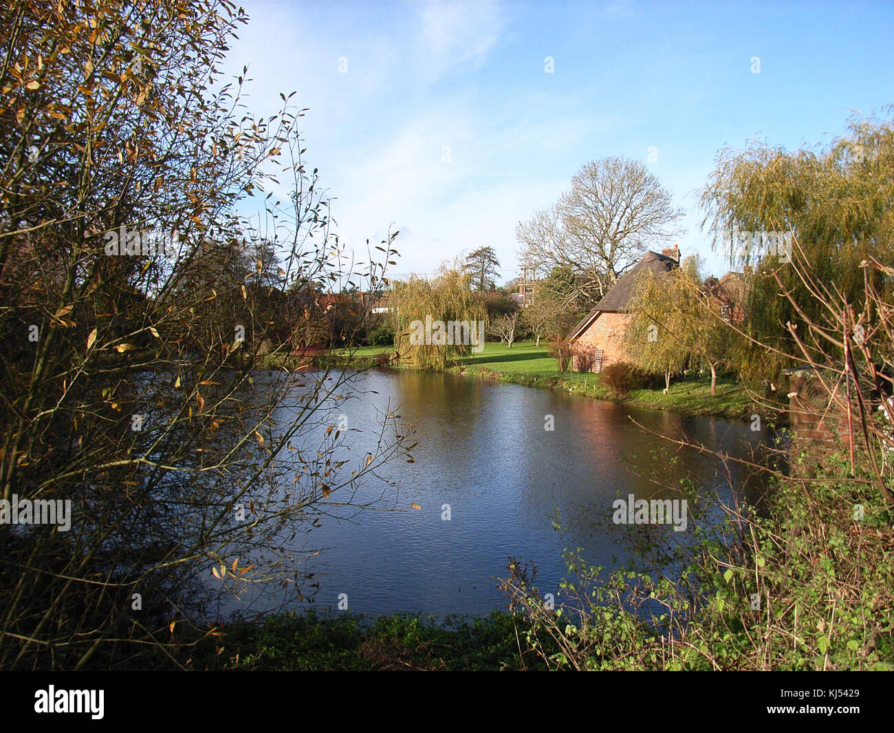 A scenic view of the River Kennet flowing through the village of ...
