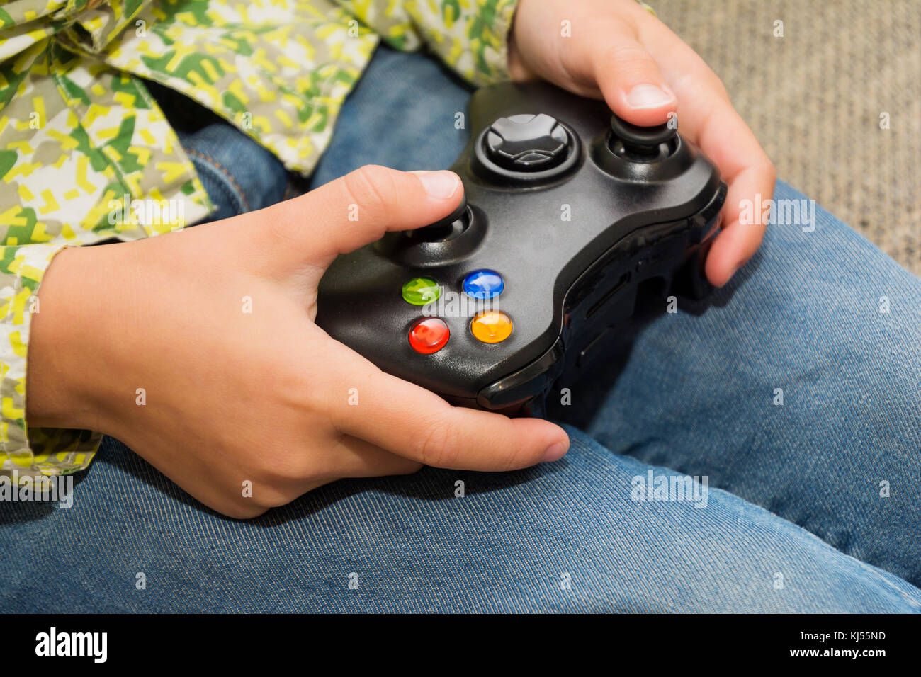 Hands Holding a Joystick Controller while playing a video games at home ...