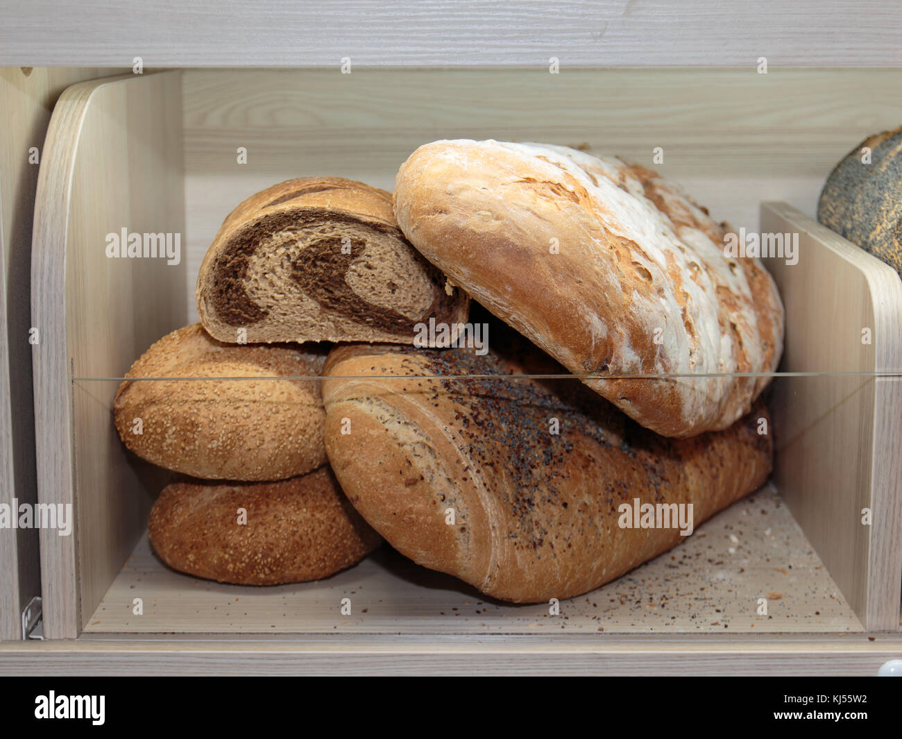 Bread Assortment shown inside White Compartment in Bakery Stock Photo ...