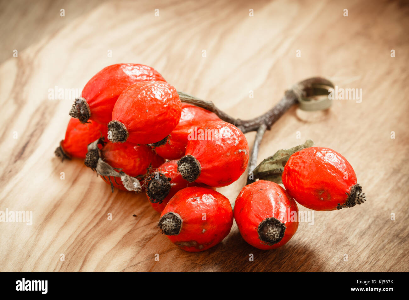 Hawthorn on wooden rustic table background. Rose hips haw fruit of the ...