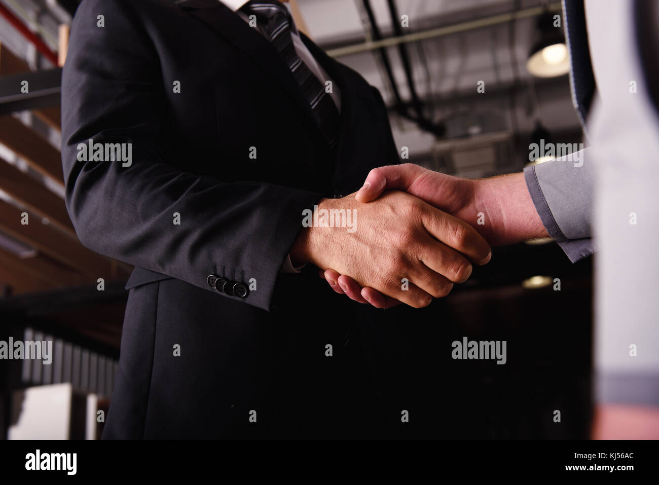 Handshaking business person in the office. concept of teamwork and ...