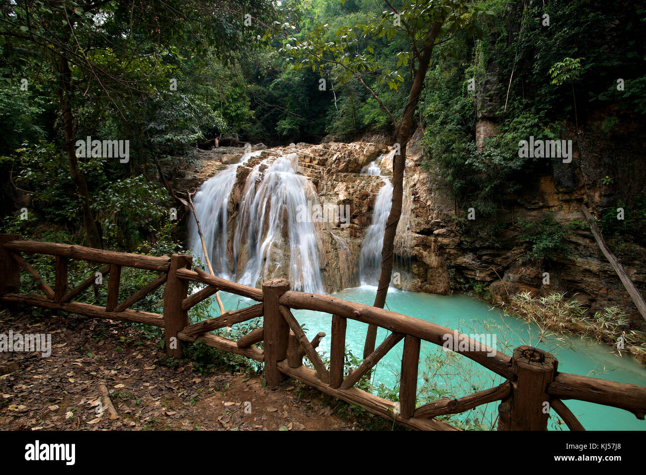 beautiful waterfall with blue water in green forest Stock Photo - Alamy