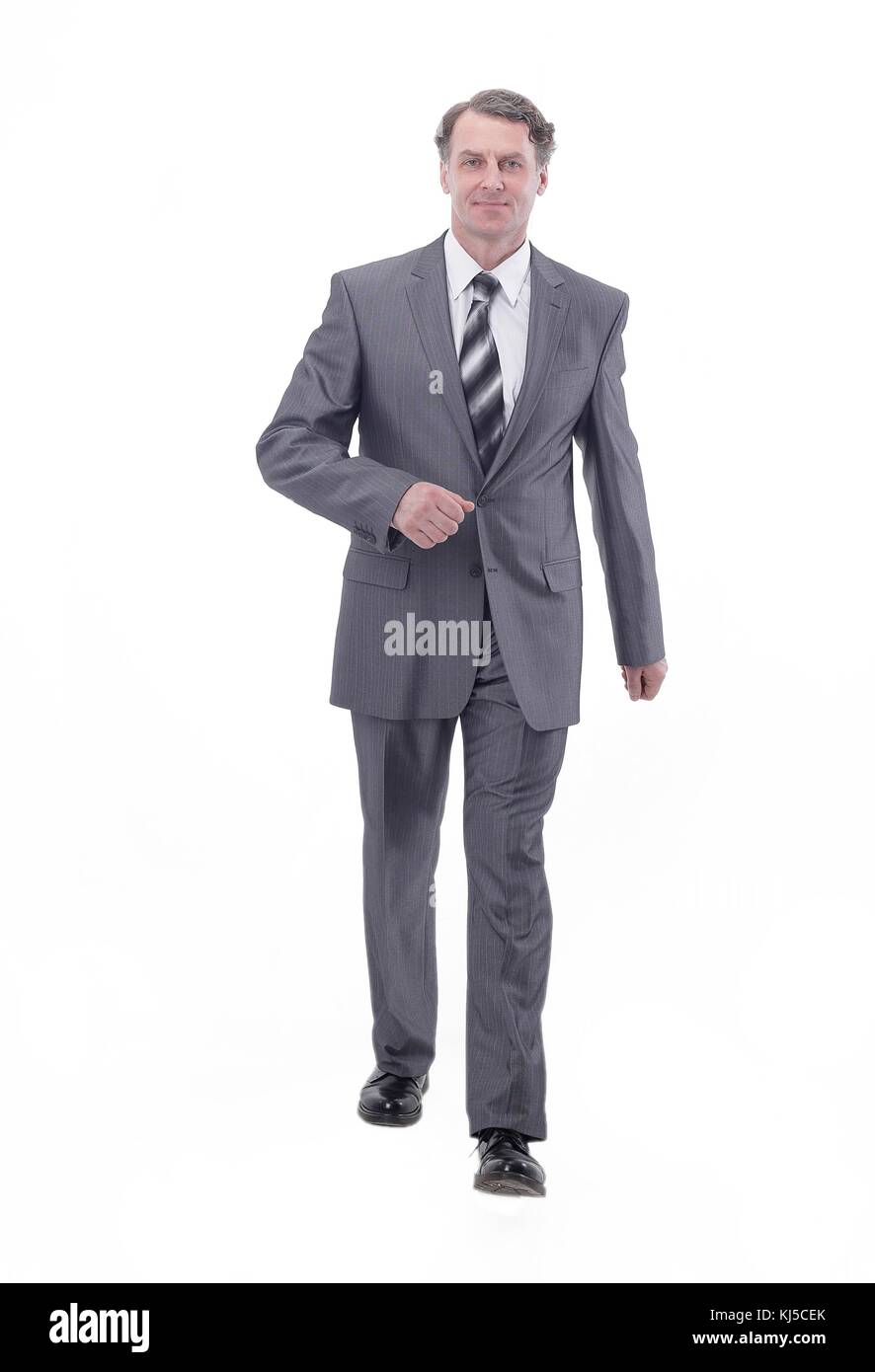 in all growth.a successful businessman, confidently striding forward ...