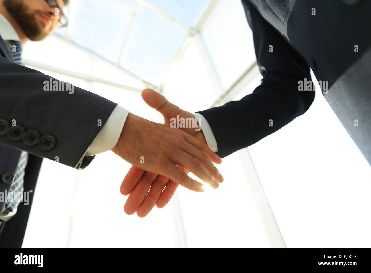 Two business men going to make handshake Stock Photo - Alamy