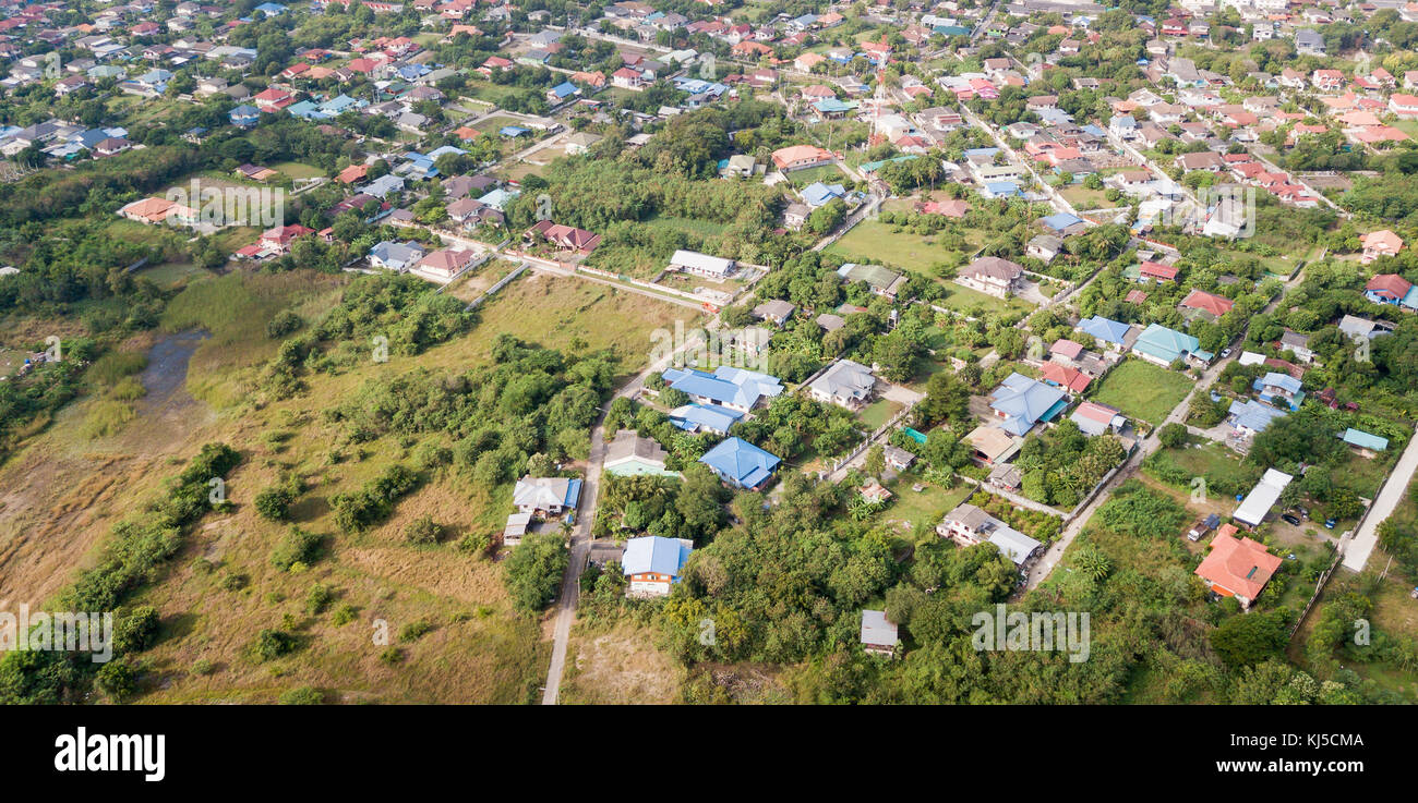 aerial from drone: neighborhood with residential houses and driveways ...