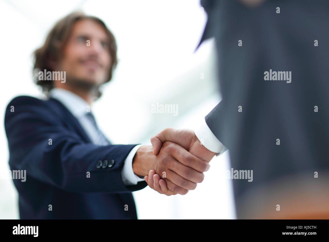 Two businessman shaking hands greeting each other Stock Photo - Alamy Two businessman shaking hands greeting each other Stock Photo - Alamy