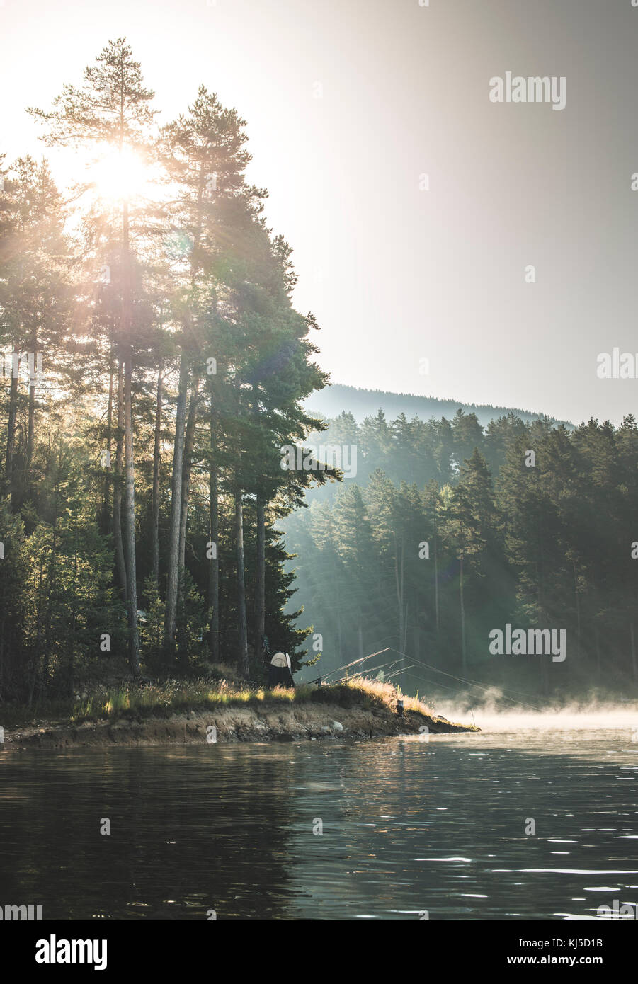 Mountain lake early in the morning. Water vapor Stock Photo - Alamy