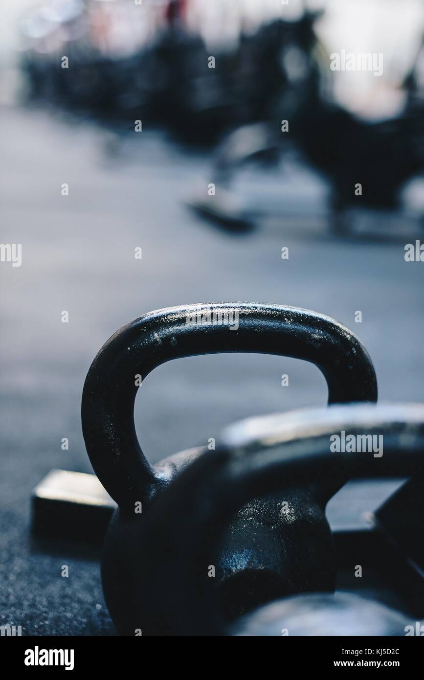 Heavy metal kettlebells weights in the gym Stock Photo - Alamy