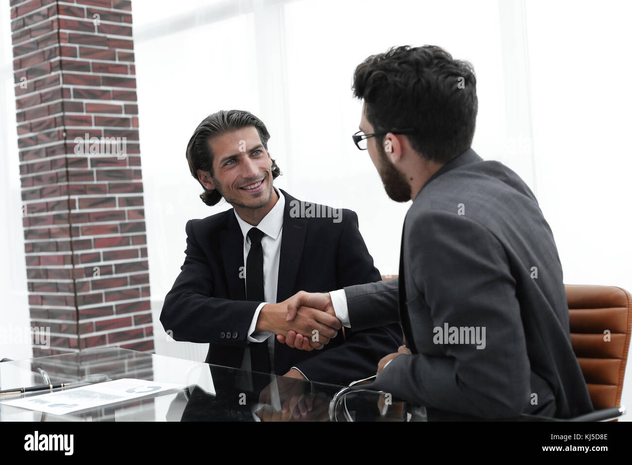 handshake reliable partners in the office Stock Photo - Alamy