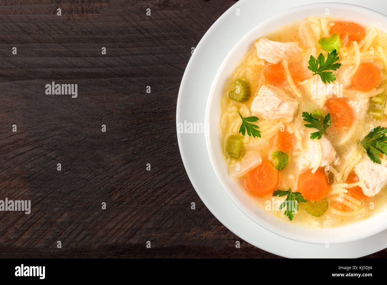 Chicken soup with noodles, overhead closeup photo with copyspace Stock ...