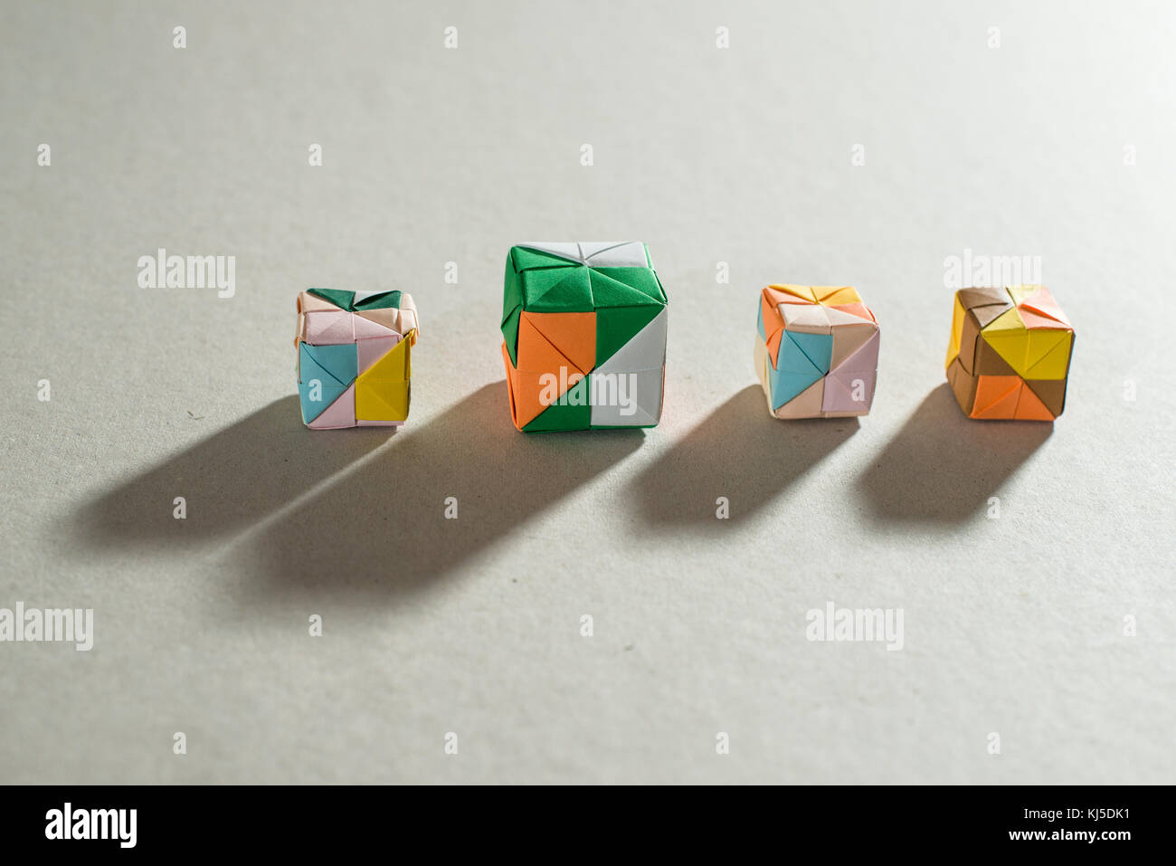 Origami cubes of paper Stock Photo - Alamy