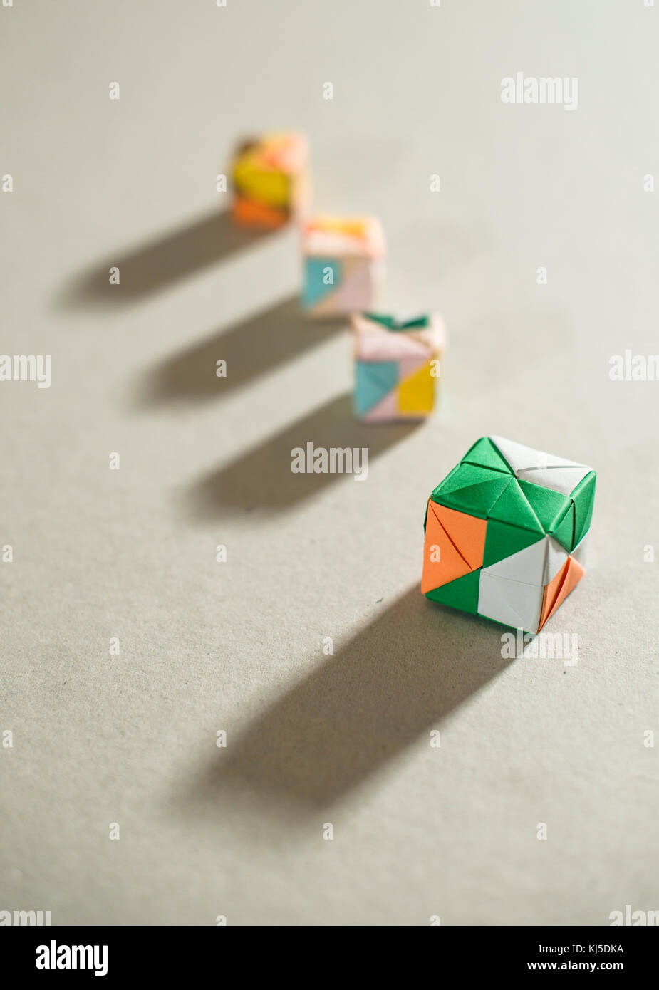 Origami cubes of paper Stock Photo - Alamy