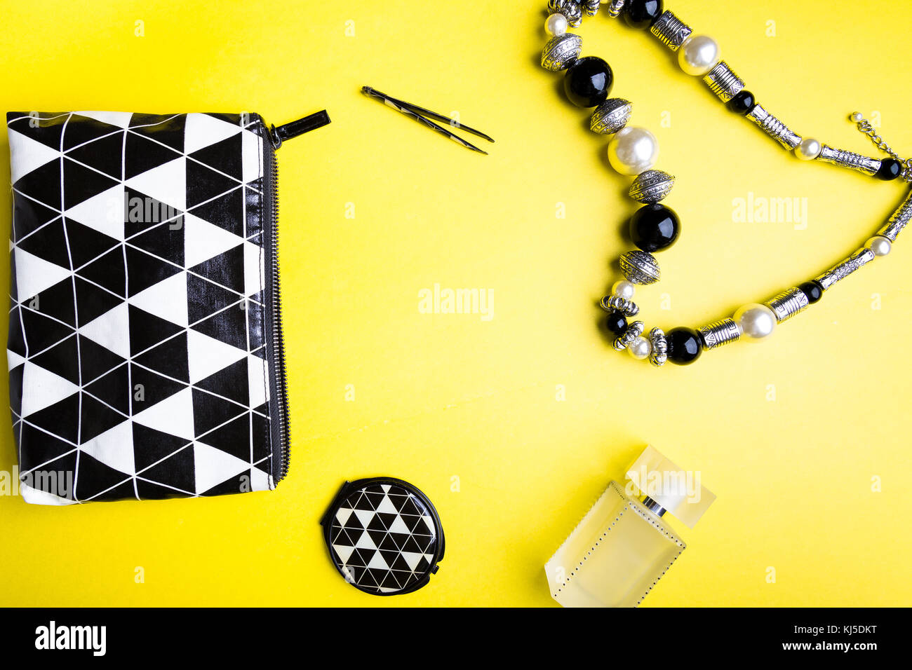 Woman handbag with makeup and accessories on yellow background. Flat ...