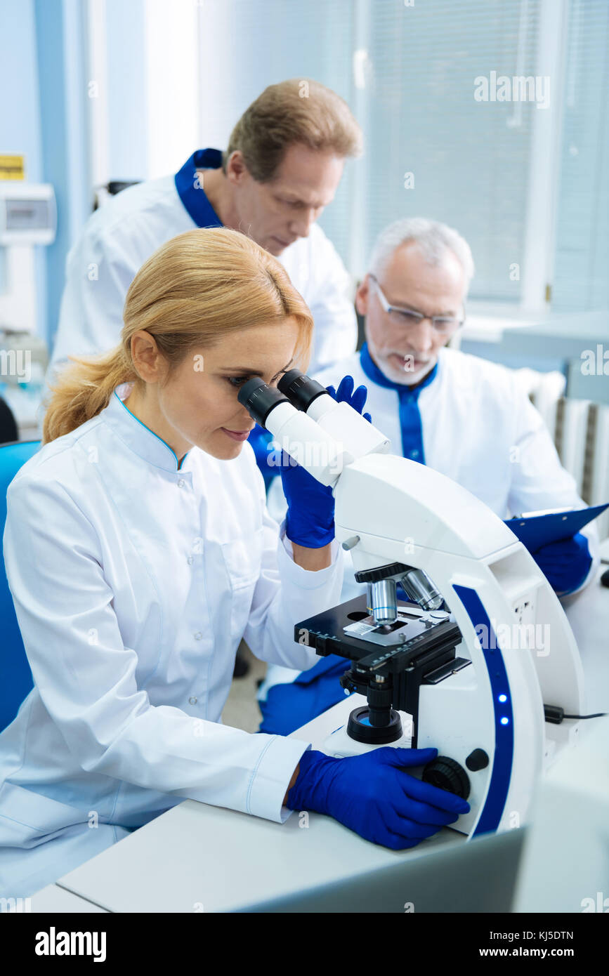 Determined young scientist working in the lab Stock Photo - Alamy