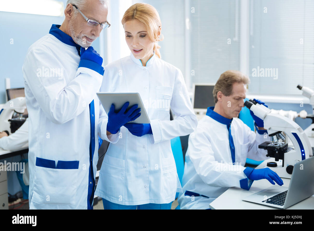 Experienced scientists consulting each other Stock Photo - Alamy
