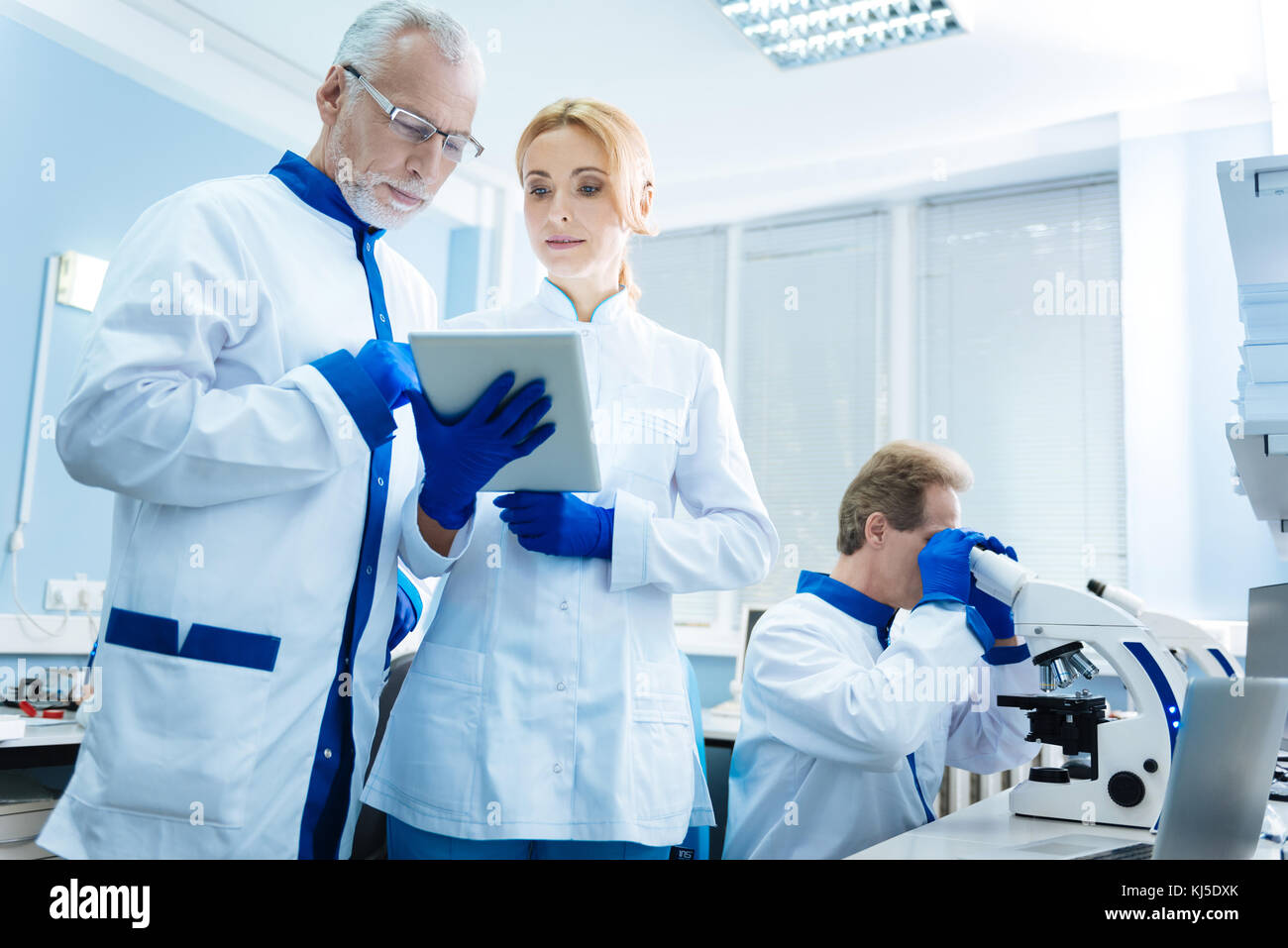 Consulting each other hi-res stock photography and images - Alamy