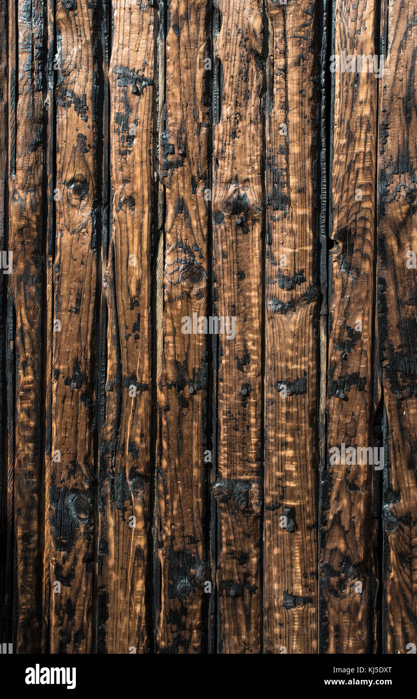Burnt wooden boards background Stock Photo - Alamy