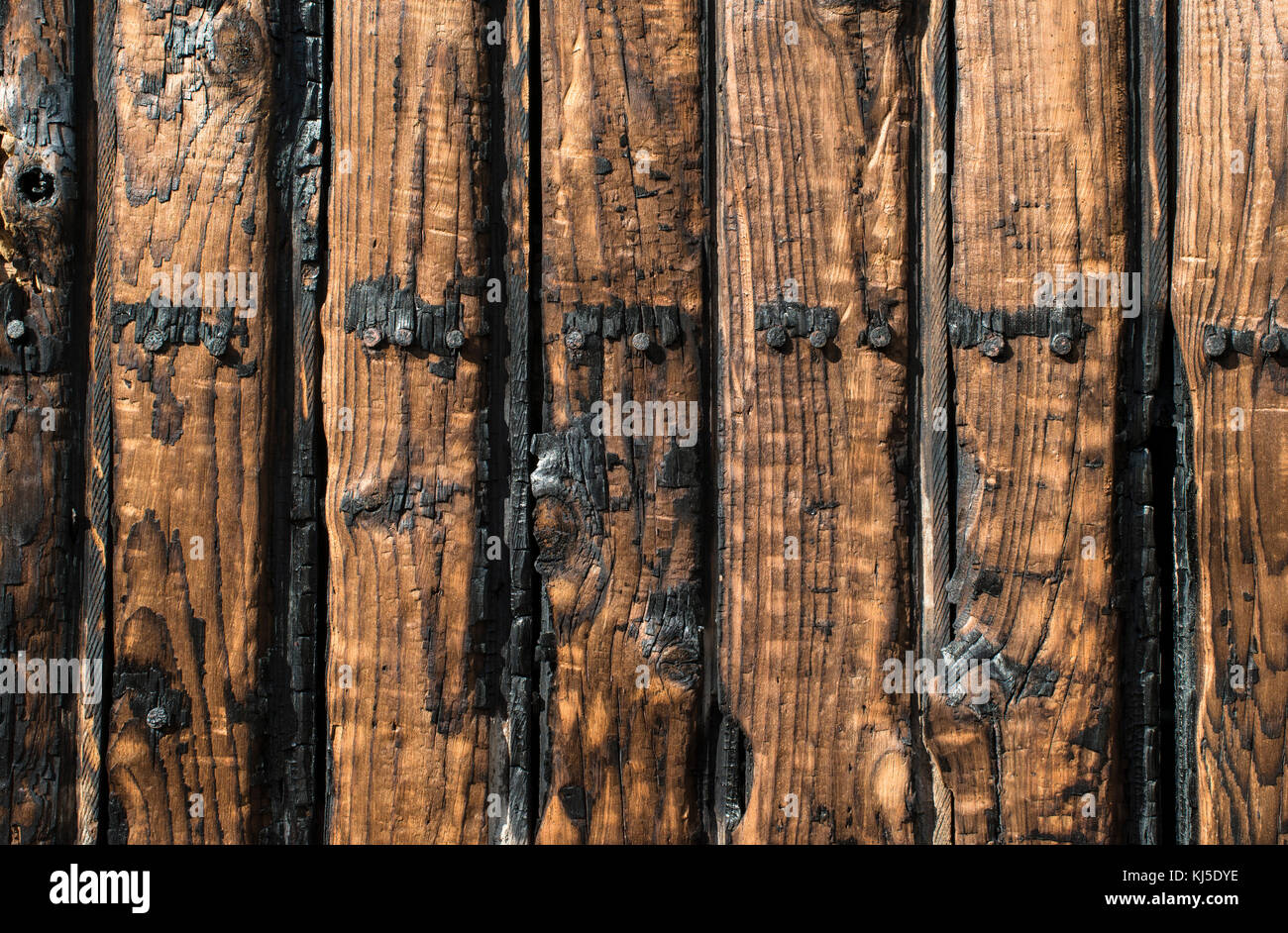 Burnt wooden boards background Stock Photo - Alamy