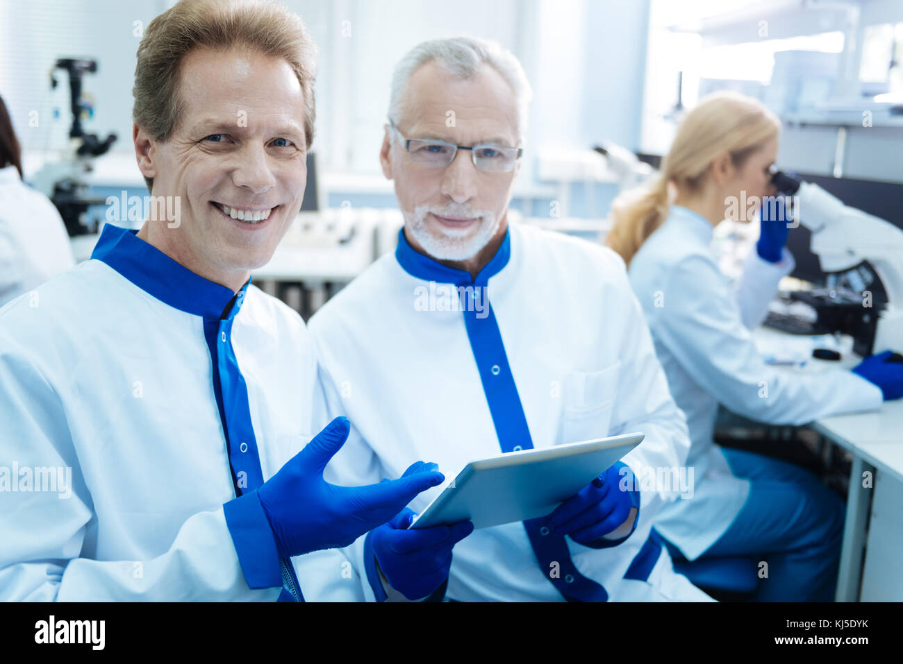Cheerful scientist sharing opinions about analysis results Stock Photo ...