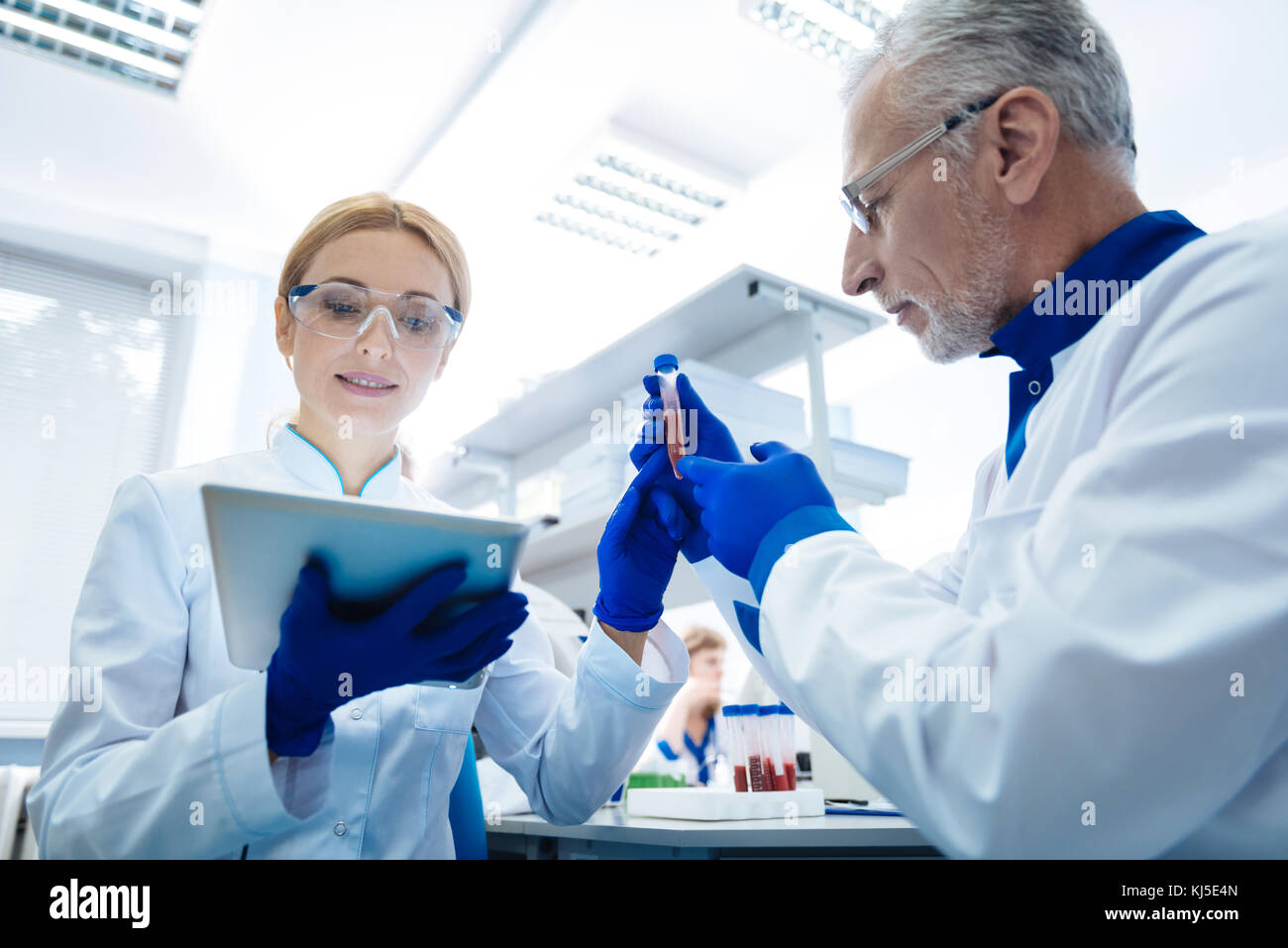 Experienced scientists conducting a serious research Stock Photo - Alamy