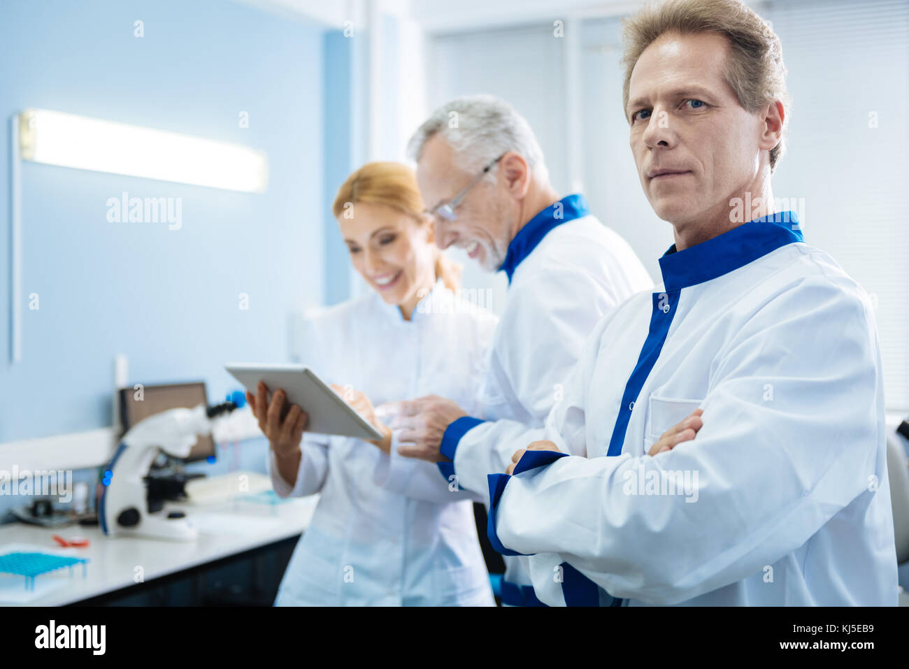 Happy people of science working in the lab Stock Photo - Alamy