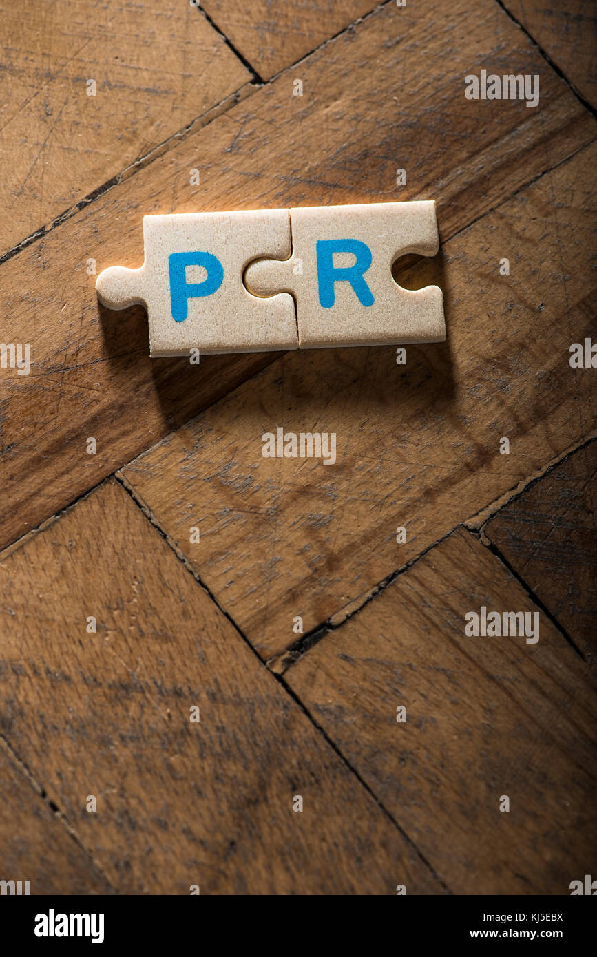 Word PR on wooden puzzle Stock Photo - Alamy